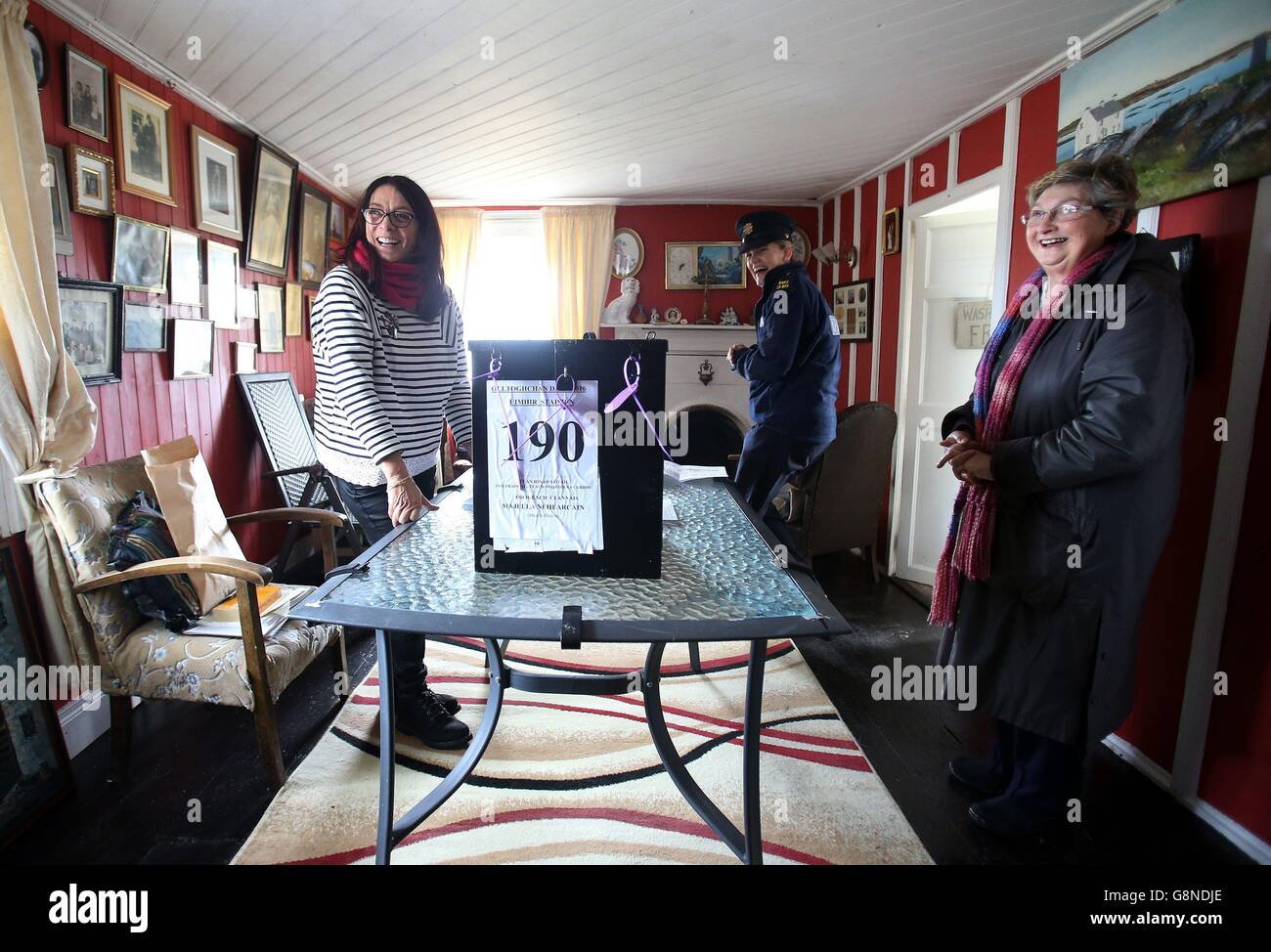 Maureen O'Sullivan (right) prepares to cast her votes as Garda Margaret ...