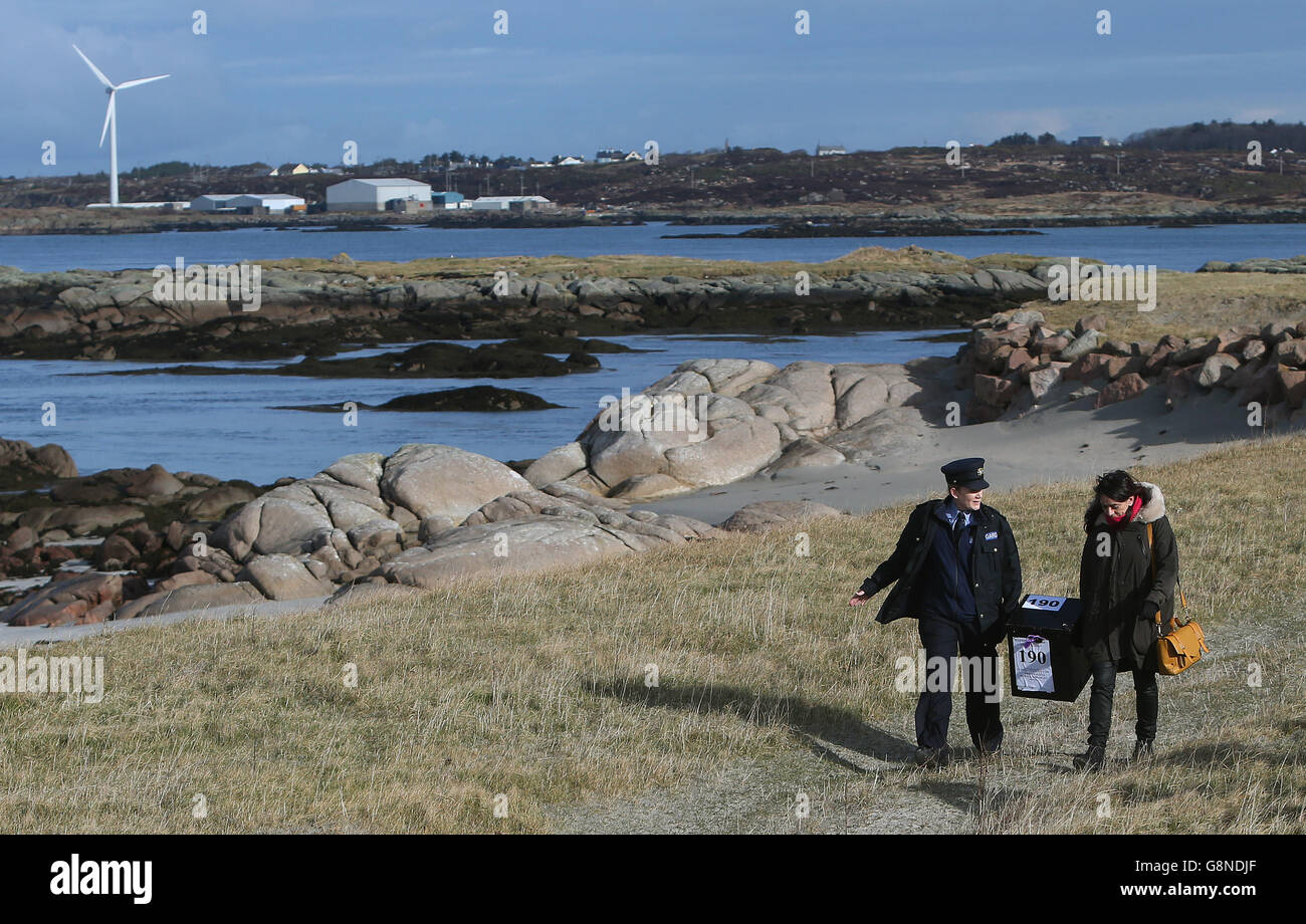 Garda Margaret Byrne (left) and presiding officer Majella Harkin carry ...