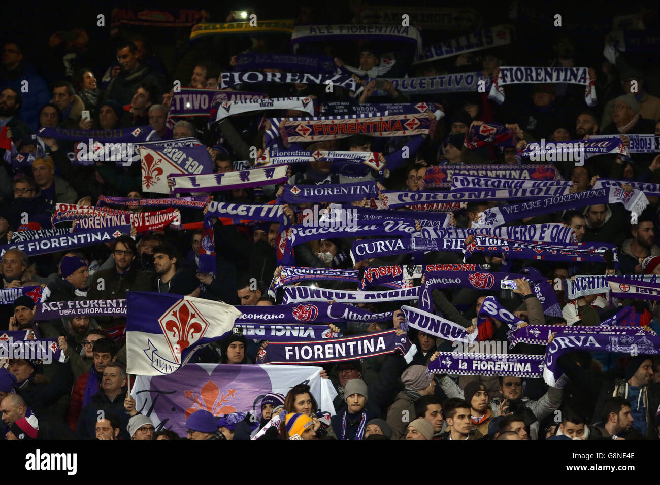 Fiorentina fans in the stands wave scarves in support Stock Photo - Alamy