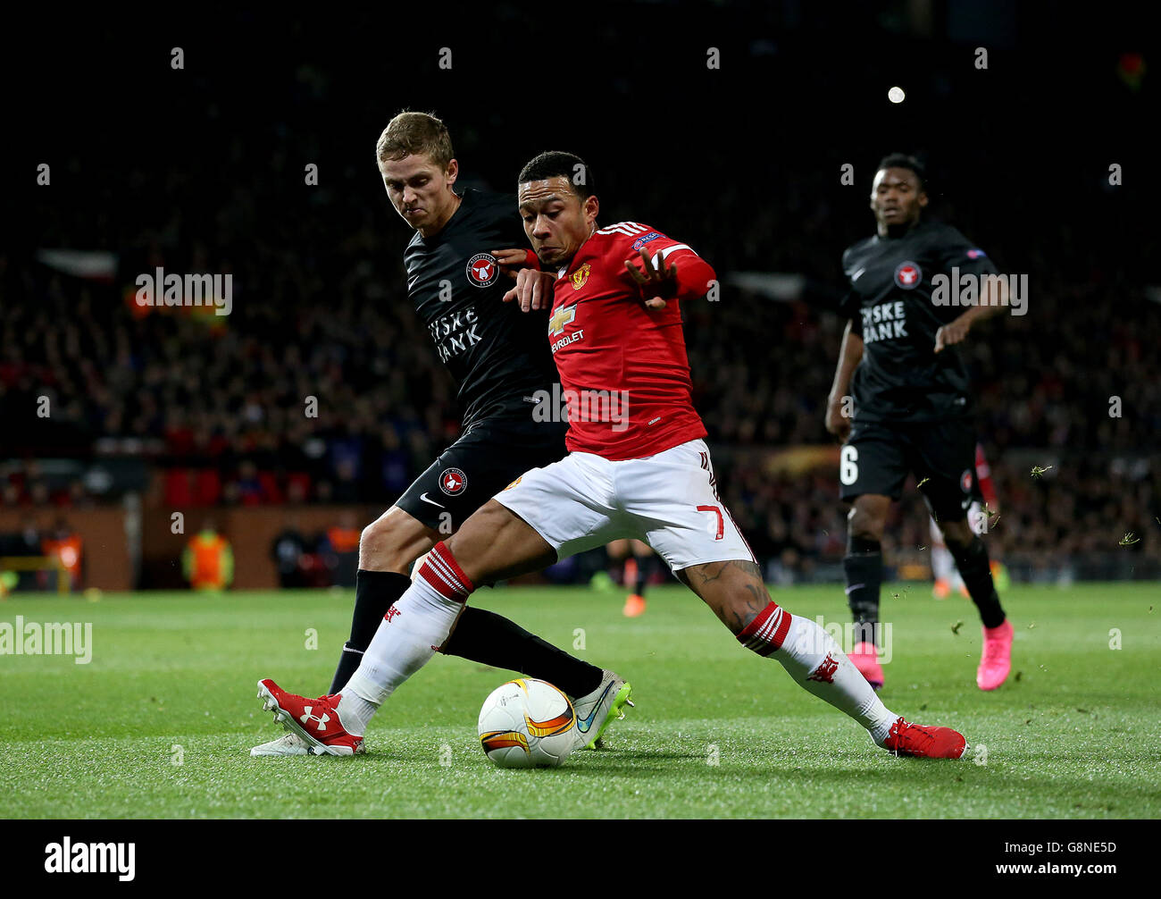 FC Midtjylland's Andre Romer (left) and Manchester United's Memphis ...