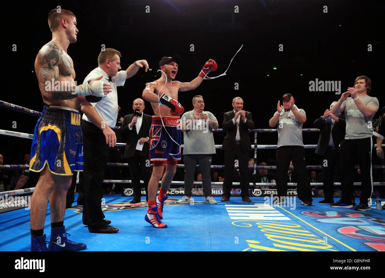 Isaac Lowe (right) celebrates beating Marco McCullough in their Vacant ...