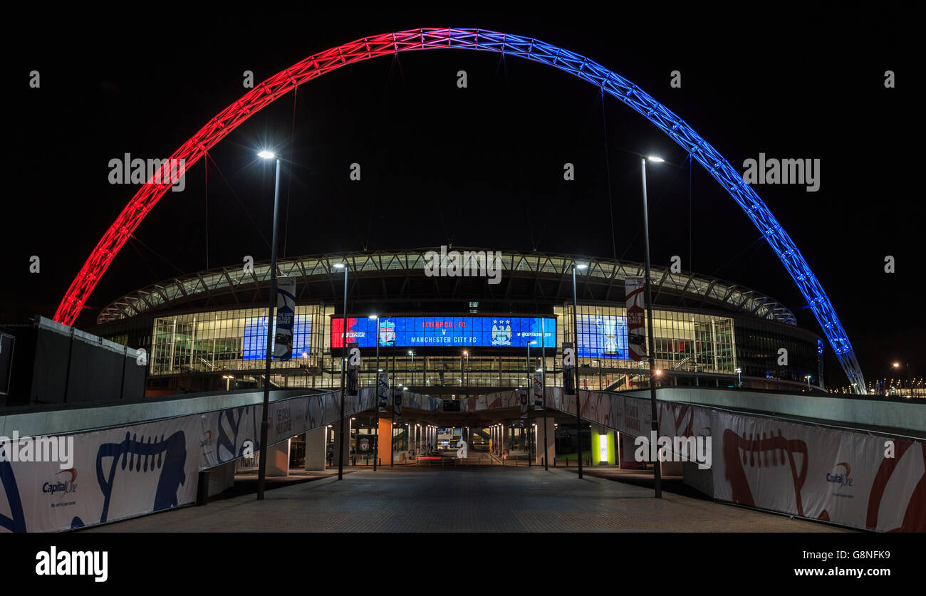 The arch over Wembley Stadium is lit up with the colour's of Liverpool ...