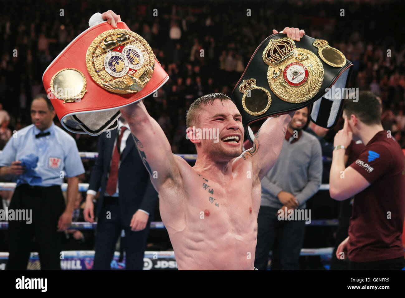 Carl Frampton celebrates beating Scott Quigg (not pictured) in their ...