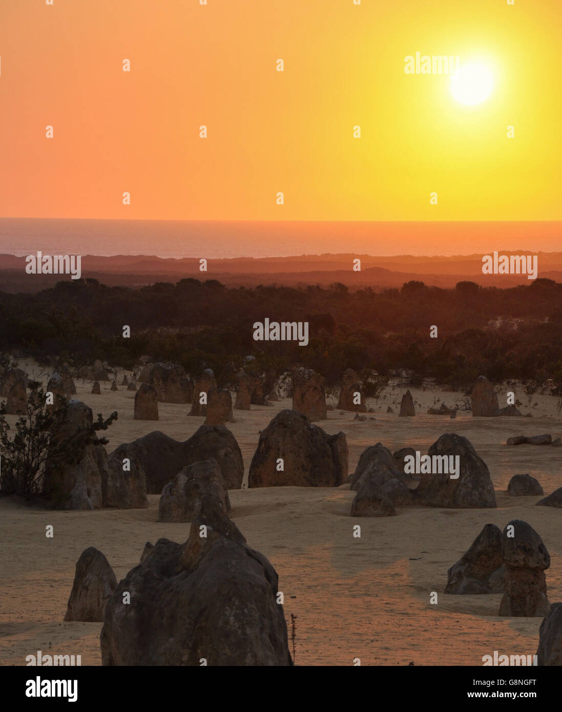 Sunset sky over the Pinnacles Desert with limestone rock formations and ...
