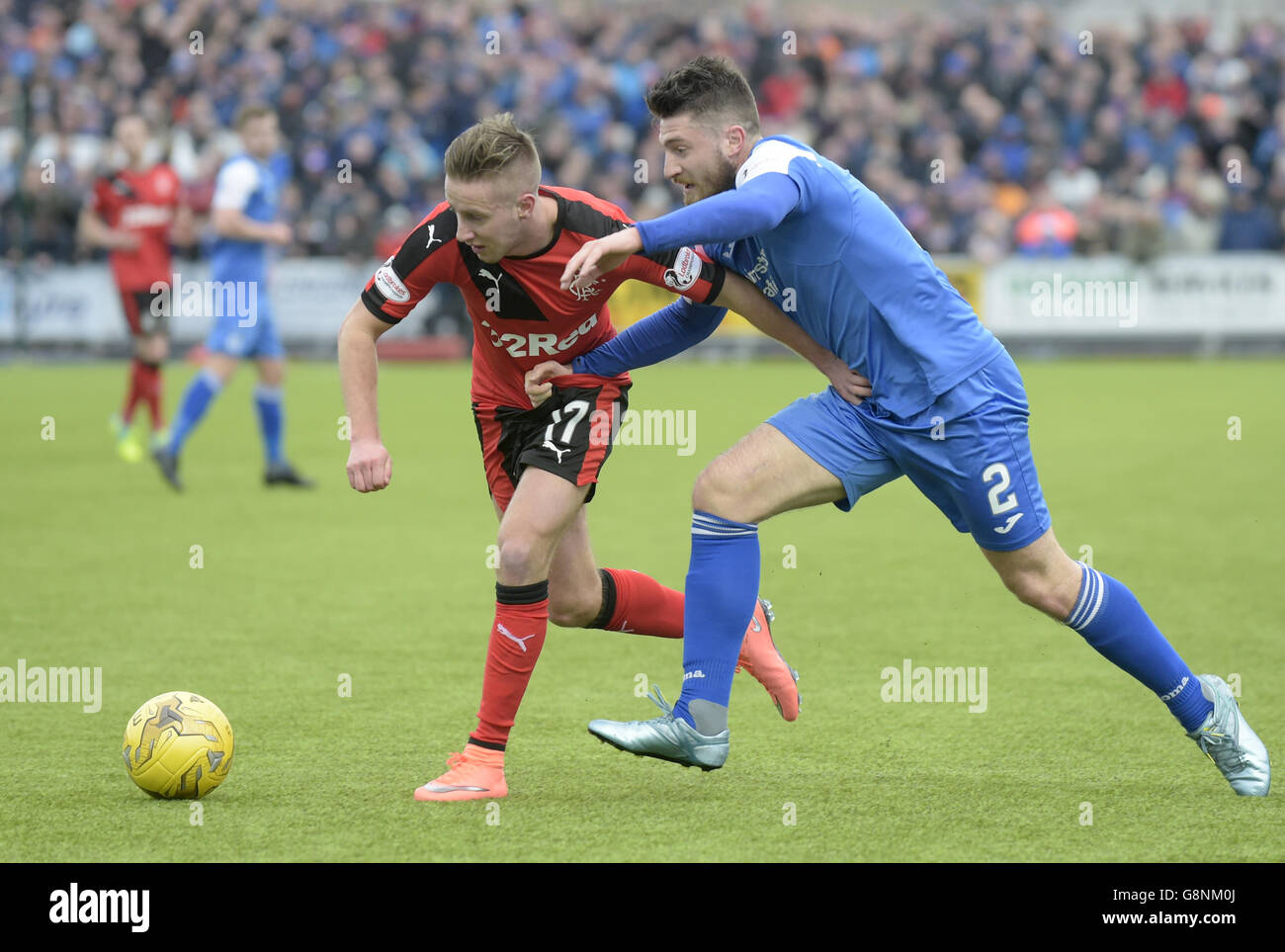 Queen of the South's Lewis Kidd and Rangers' Billy King battle for the ...