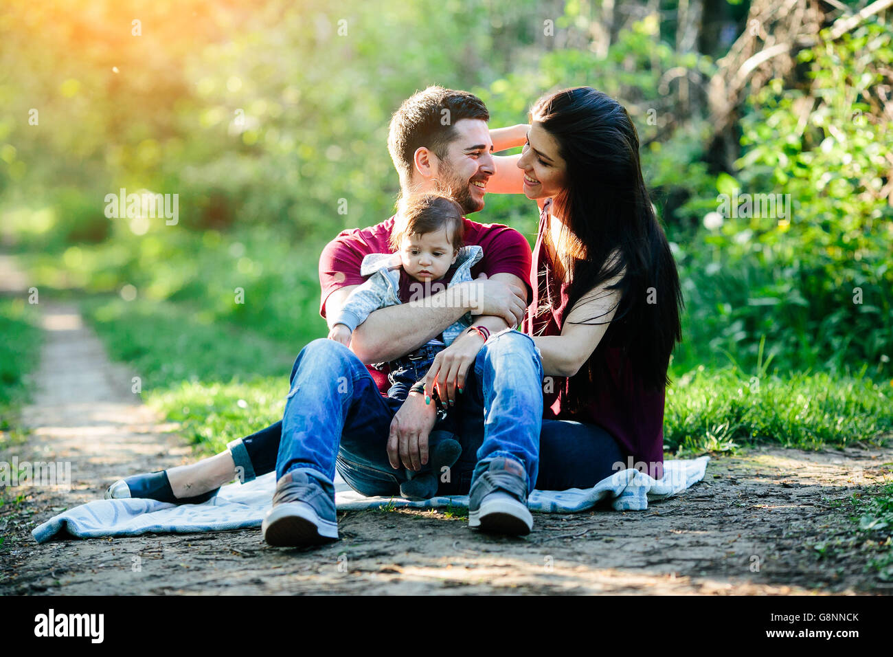 young family with a child on the nature Stock Photo - Alamy