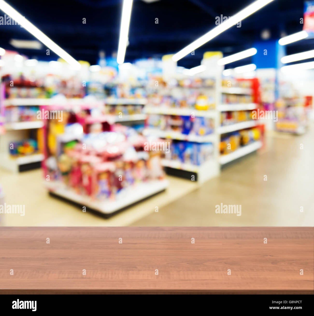 Wooden empty table in front of kids toy store Stock Photo - Alamy