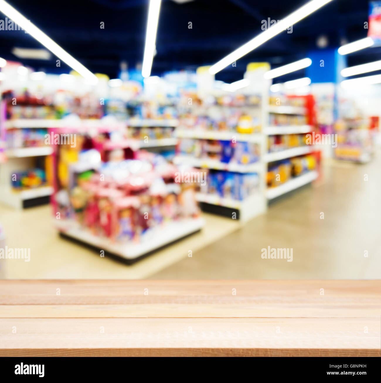 Wooden empty table in front of kids toy store Stock Photo - Alamy