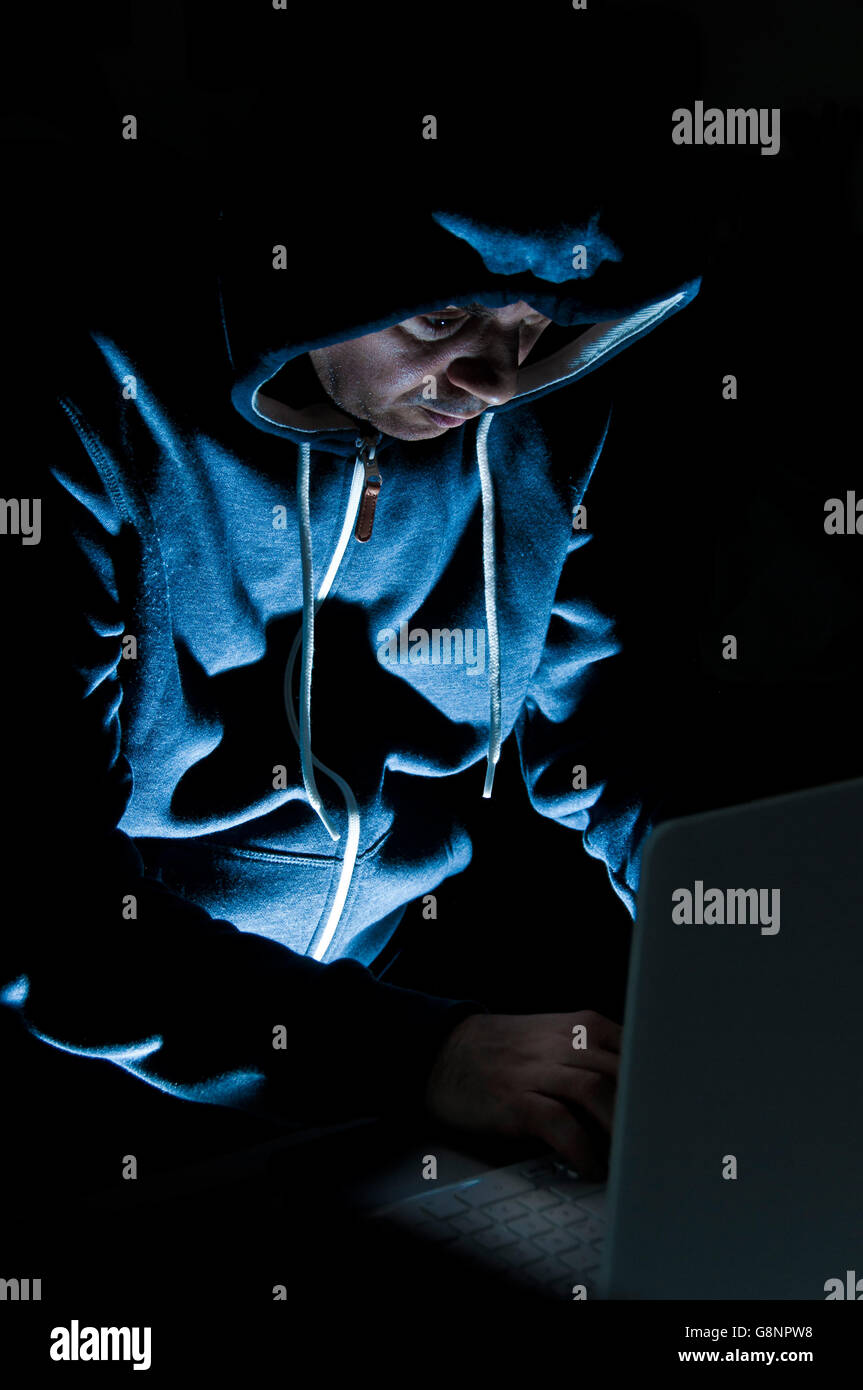 hacker in action in the dark Stock Photo - Alamy