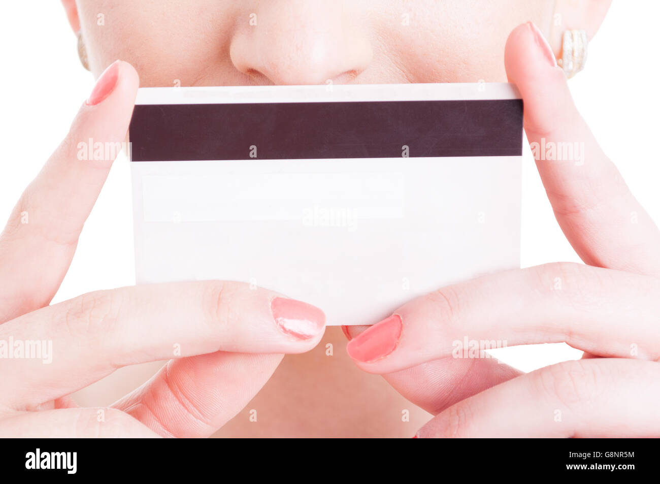 Woman face holding credit debit card in front of the mouth close-up ...