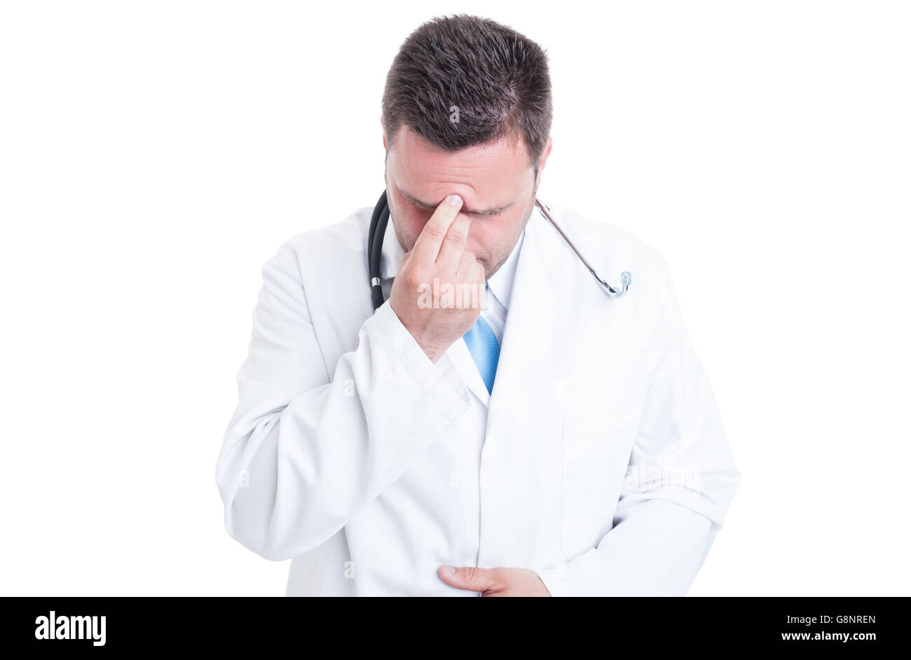 Male doctor or medic pressing his forehead like feeling a headache ...