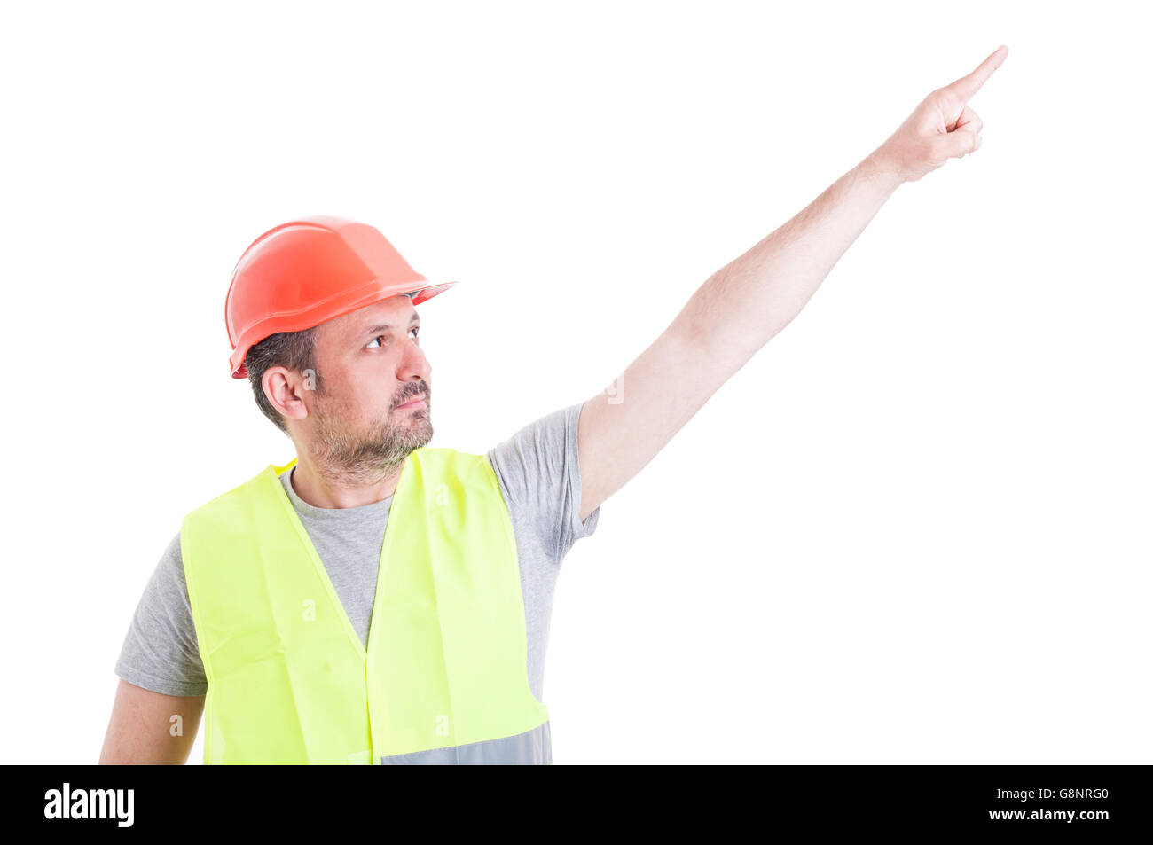 Attractive constructor man pointing finger up and showing something or ...
