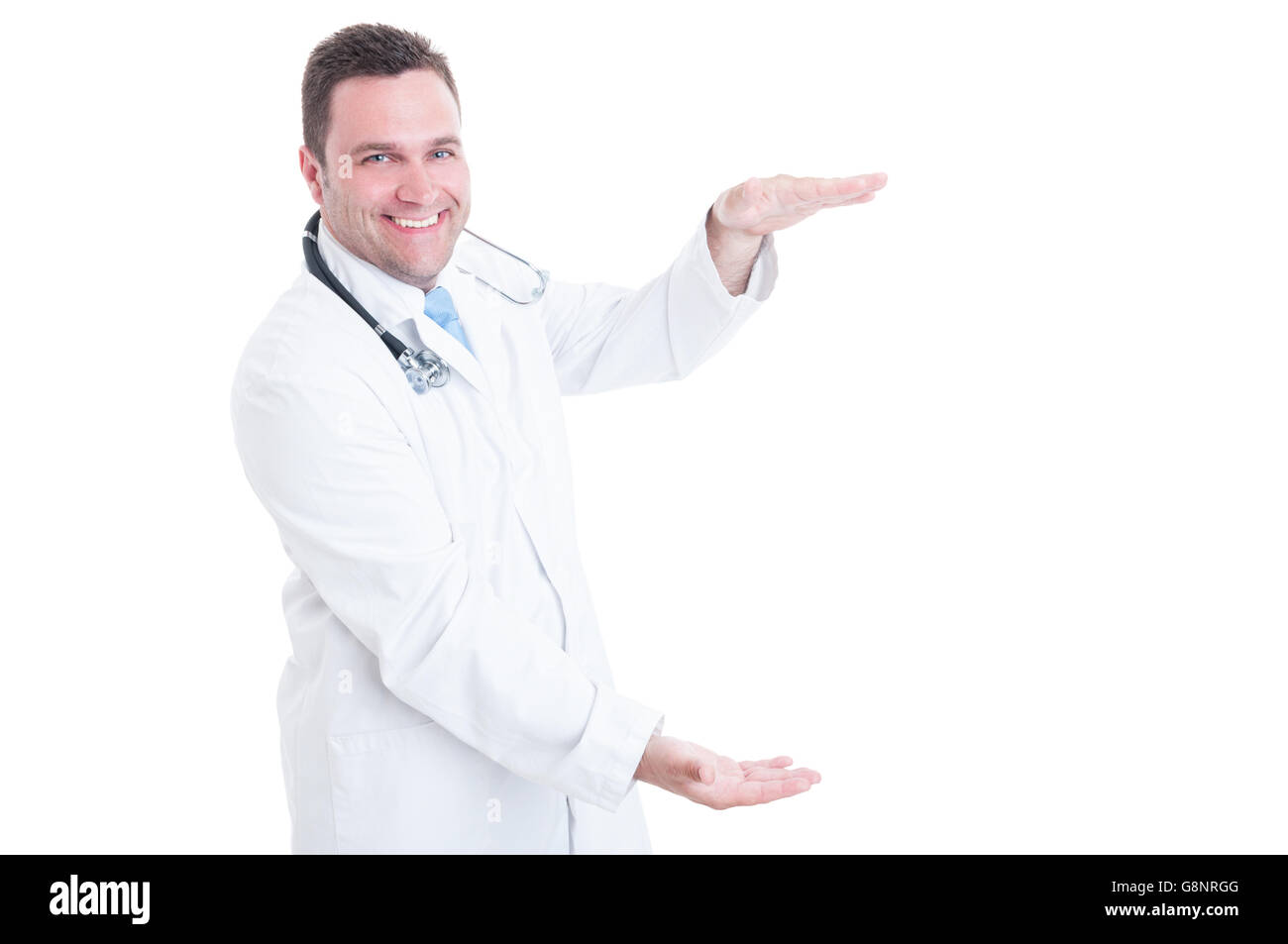 Male medic or doctor smiling and holding copyspace with two hands ...