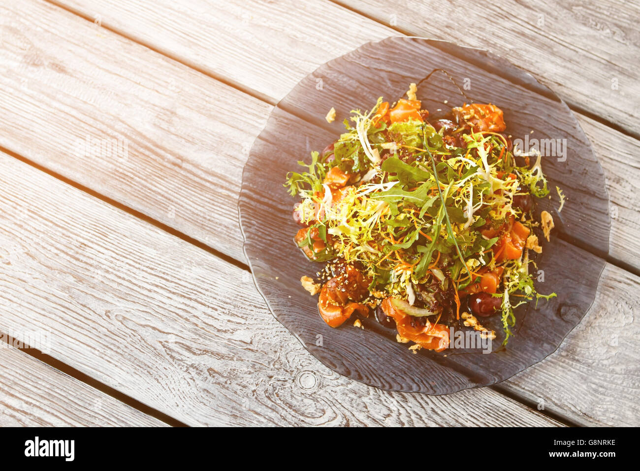 Salad lying on a plate Stock Photo - Alamy
