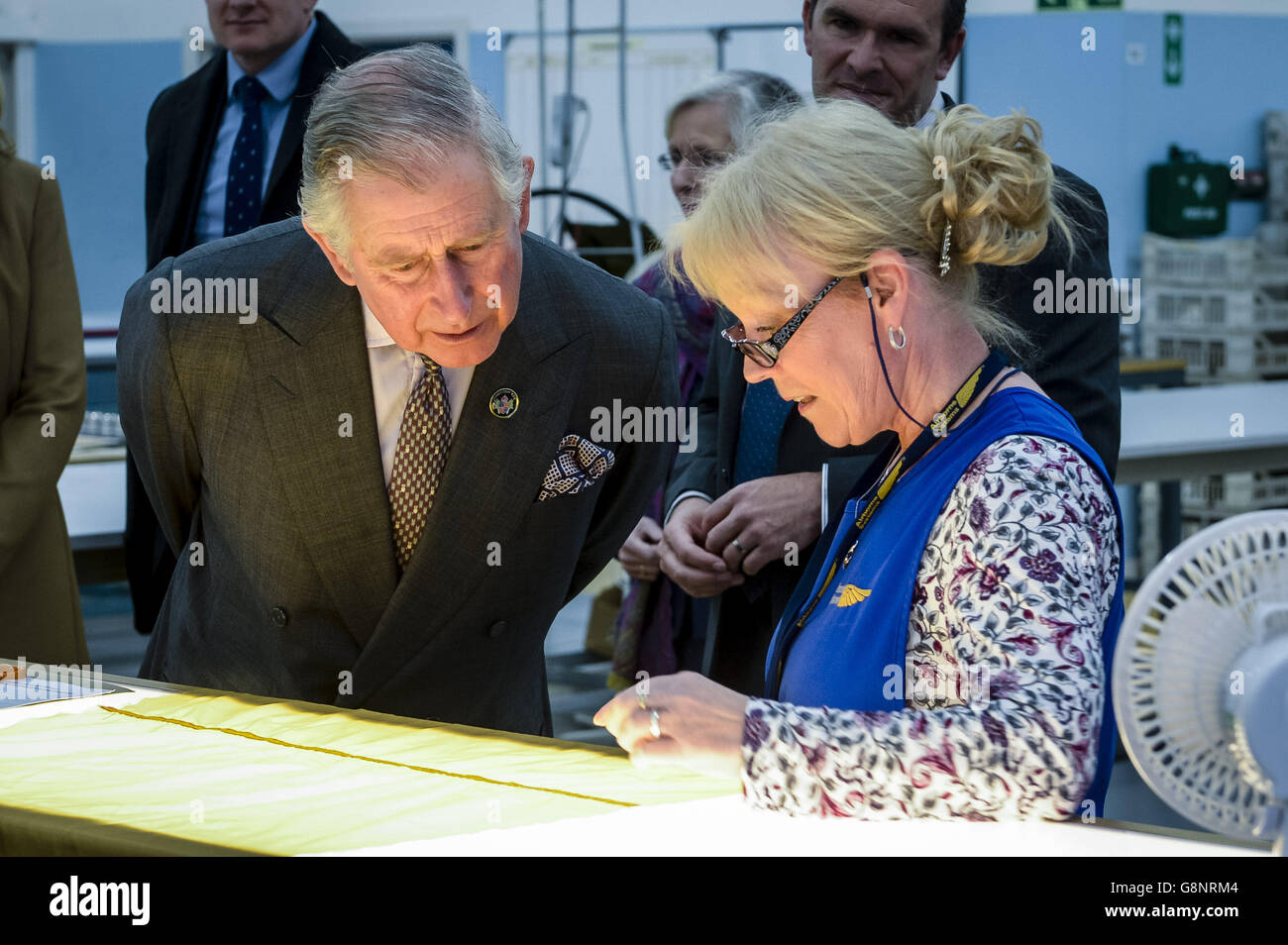 The Prince of Wales is shown a parachute material and stitching by ...