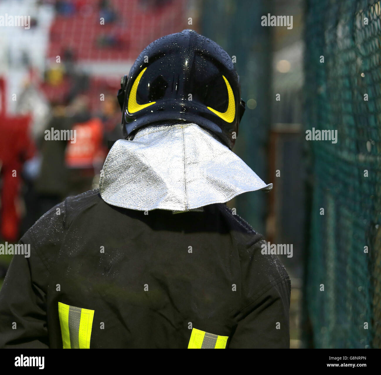 Firefighter with riot helmet for the security service in the Stadium ...