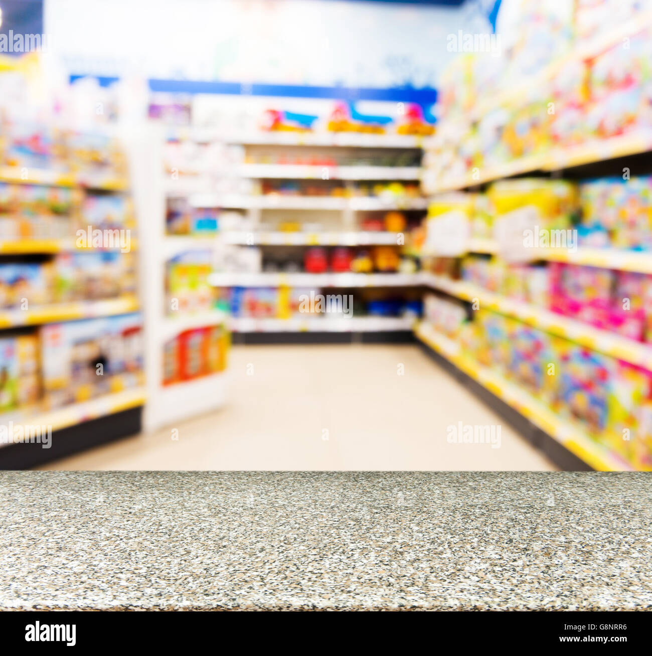 Marble board empty table in front of kids toy shop Stock Photo - Alamy
