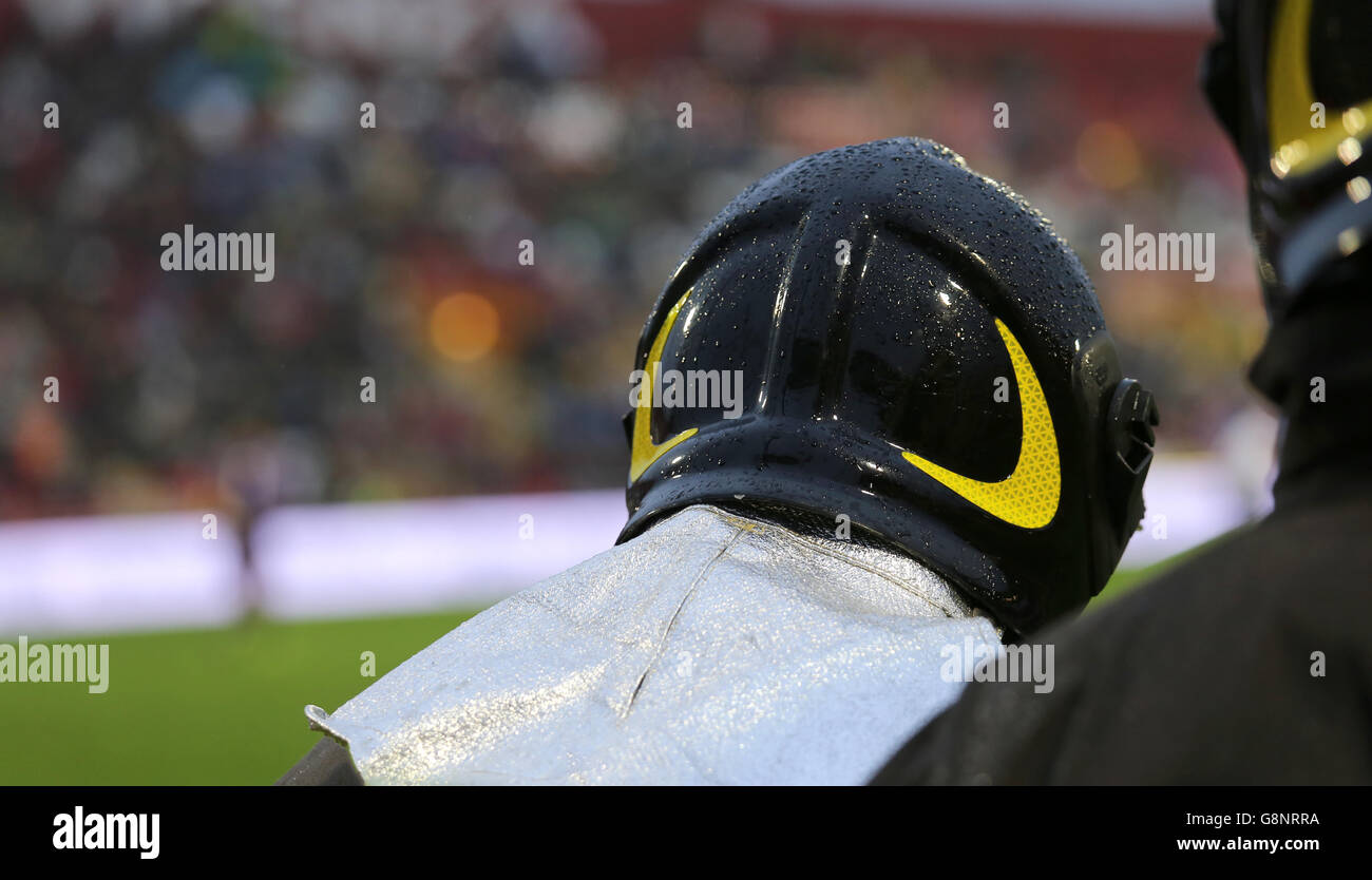Firefighter with helmet in the Stadium during the sporting event Stock ...