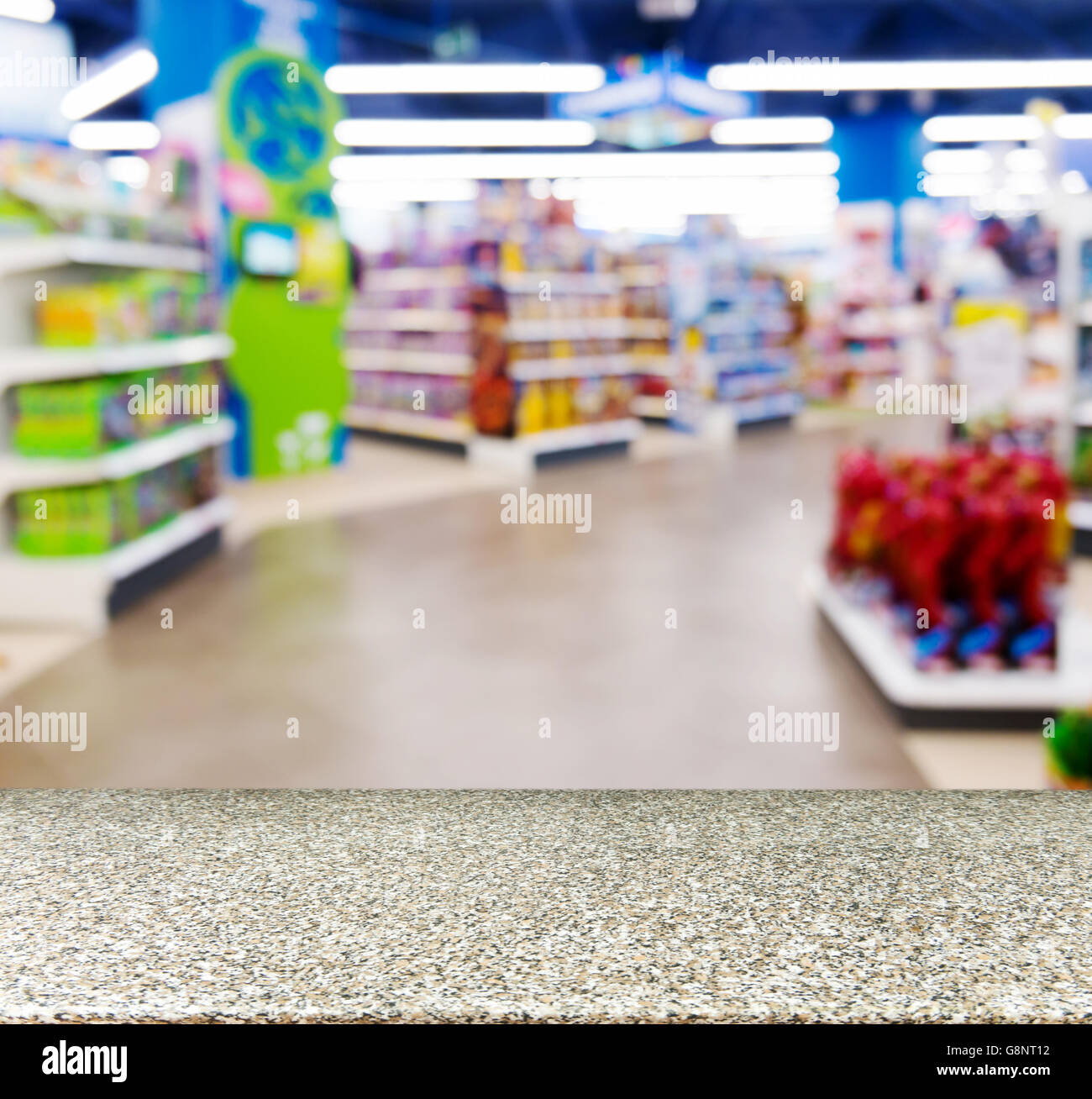 Marble board empty table in front of kids toy shop Stock Photo - Alamy