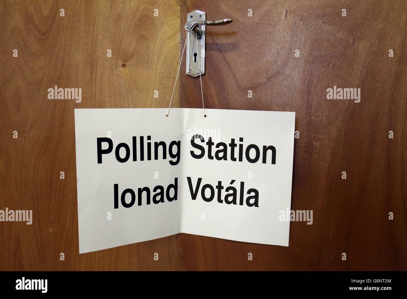A polling station sign hangs on a door at Trinity Presbyterian Hall in ...