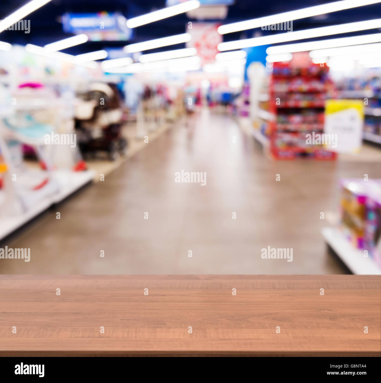 Wooden empty table in front of of kids toy store Stock Photo - Alamy