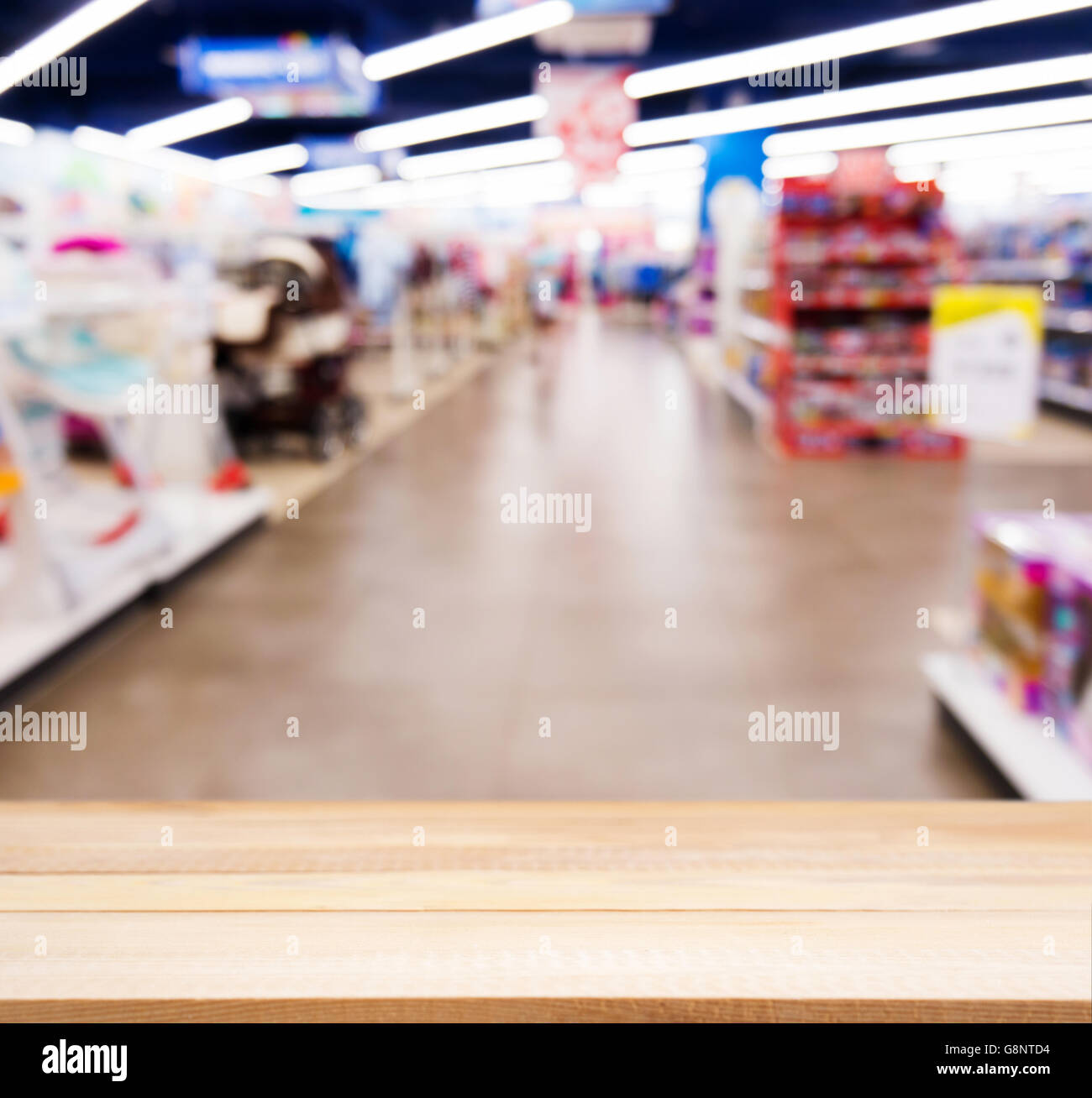 Wooden empty table in front of of kids toy store Stock Photo - Alamy