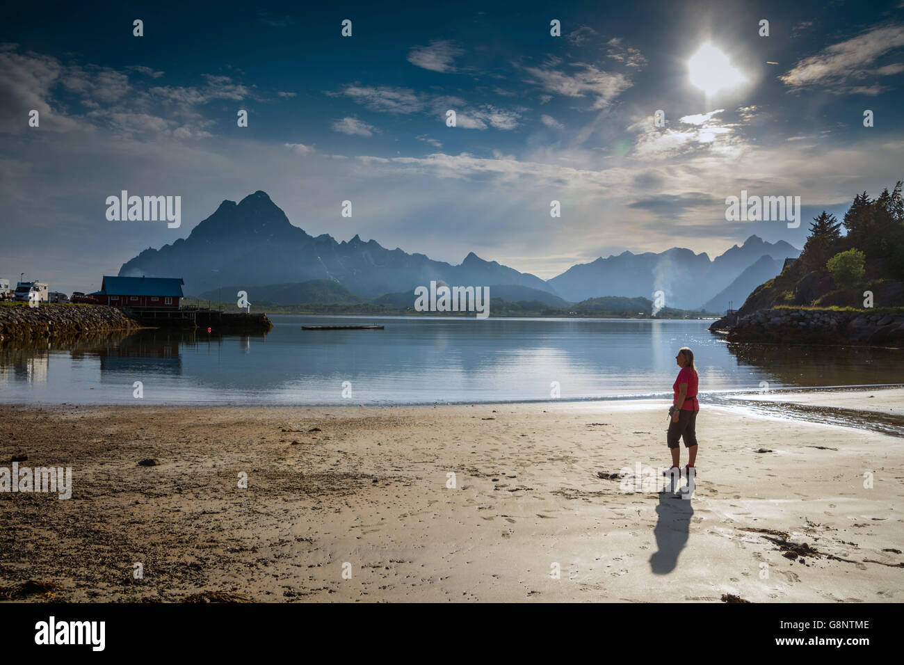 Figure on sandy beach and Vagakalen mountain from Orsvagvaer, Sandvik ...