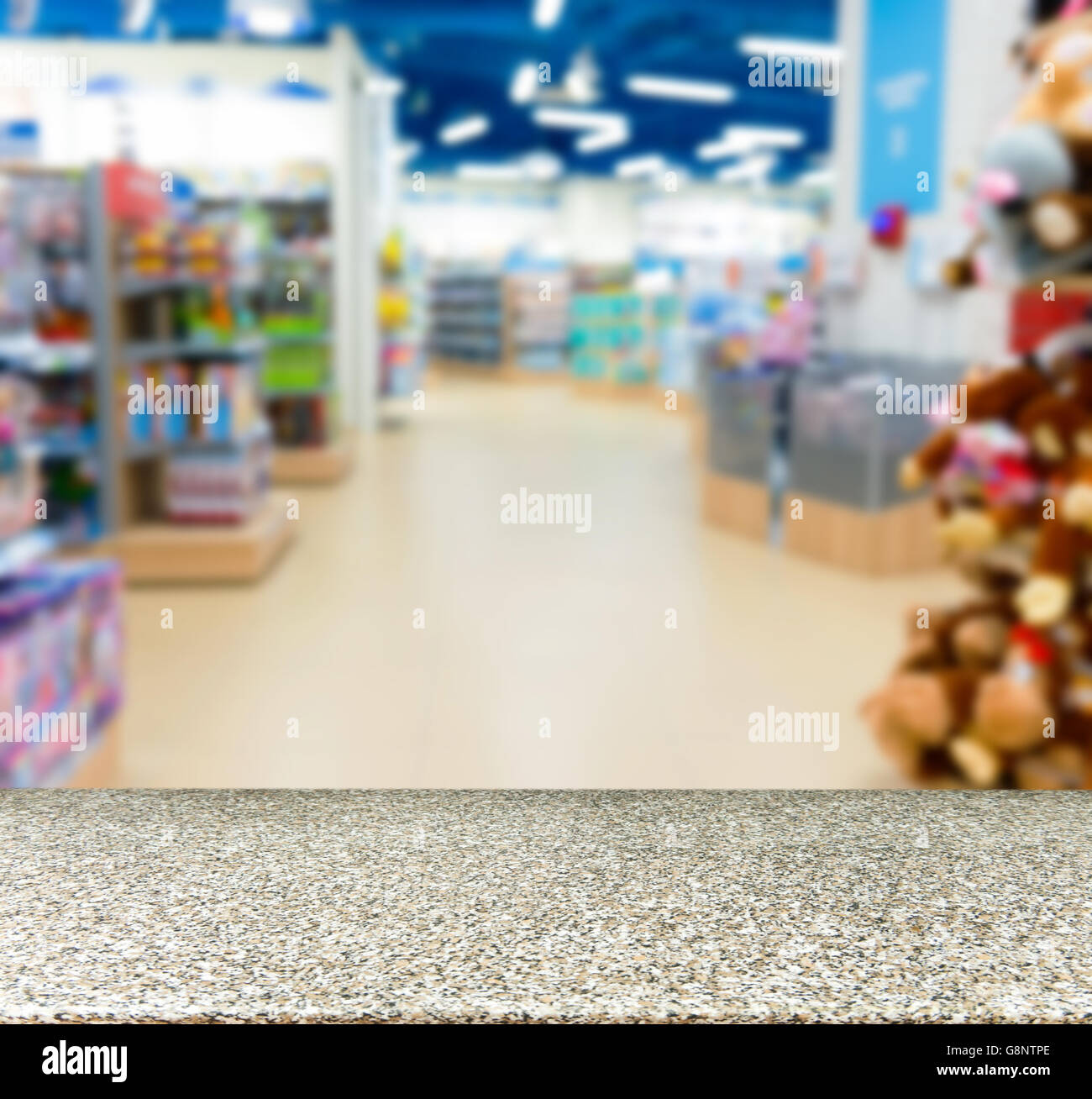 Marble empty table in front of of kids toy store Stock Photo - Alamy