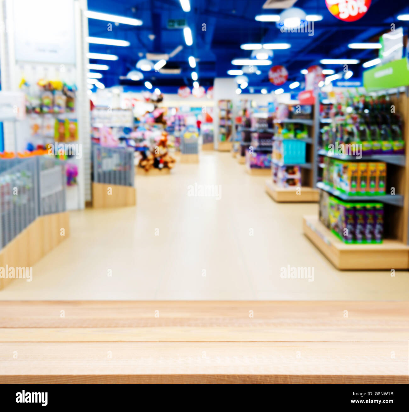 Wooden empty table in blurred of kids toy store Stock Photo - Alamy