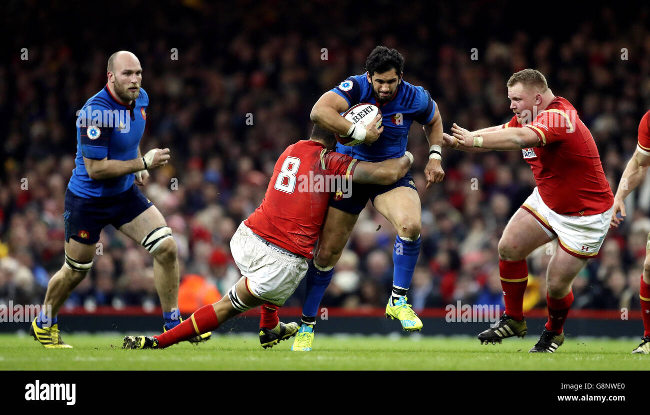 France's Maxime Mermoz is tackled by Wales' Taulupe Faletau (no.8 ...