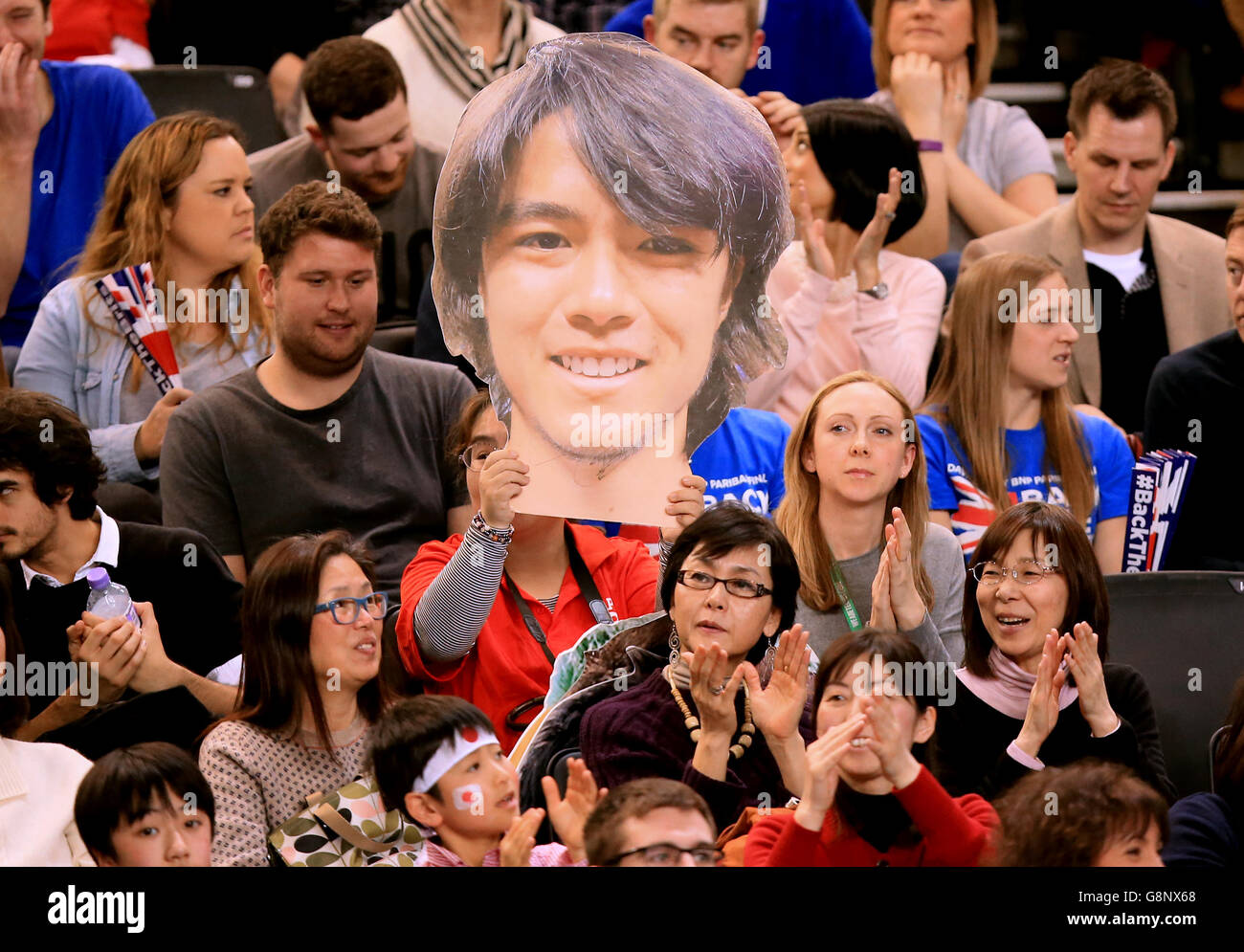 Japan fans hold up a giant cut out of Taro Daniel's face during day one ...