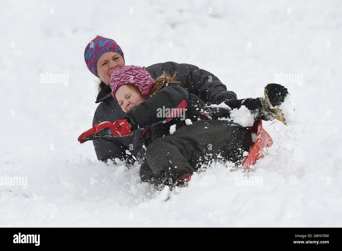 People sledging in the snow near Mam Tor in the Peak District, as March ...
