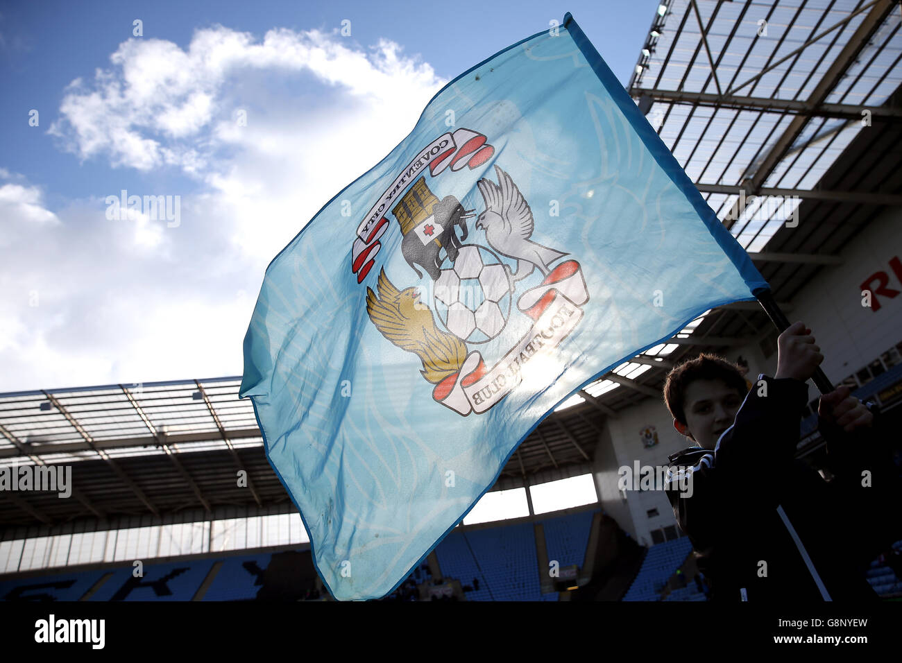A flag bearer waves the Coventry City flag before the players walk out ...