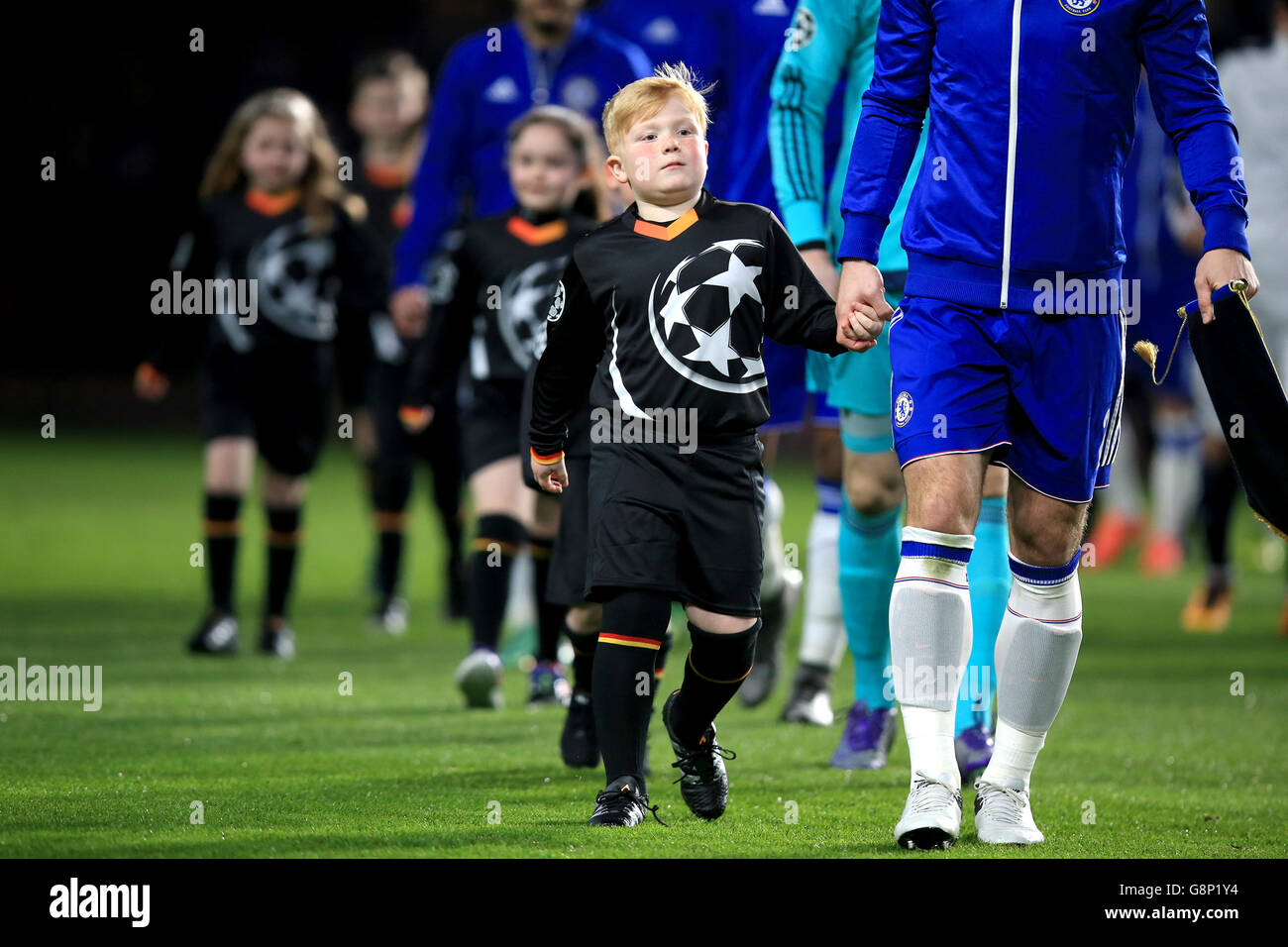 Mascots walk out onto the pitch for the match hi-res stock photography ...