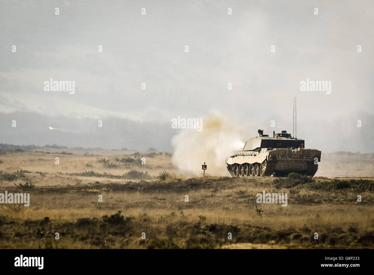 A tracer round fires from a Challenger II Main Battle Tank during live ...