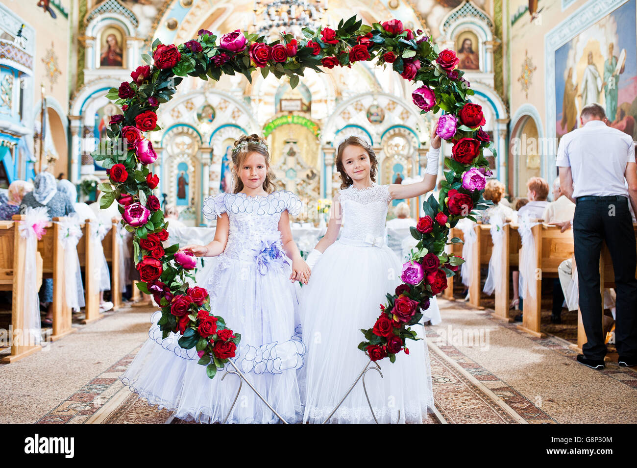 Mukyluntsi , Ukraine - 26 june, 2016: First holy communion. Two baby ...