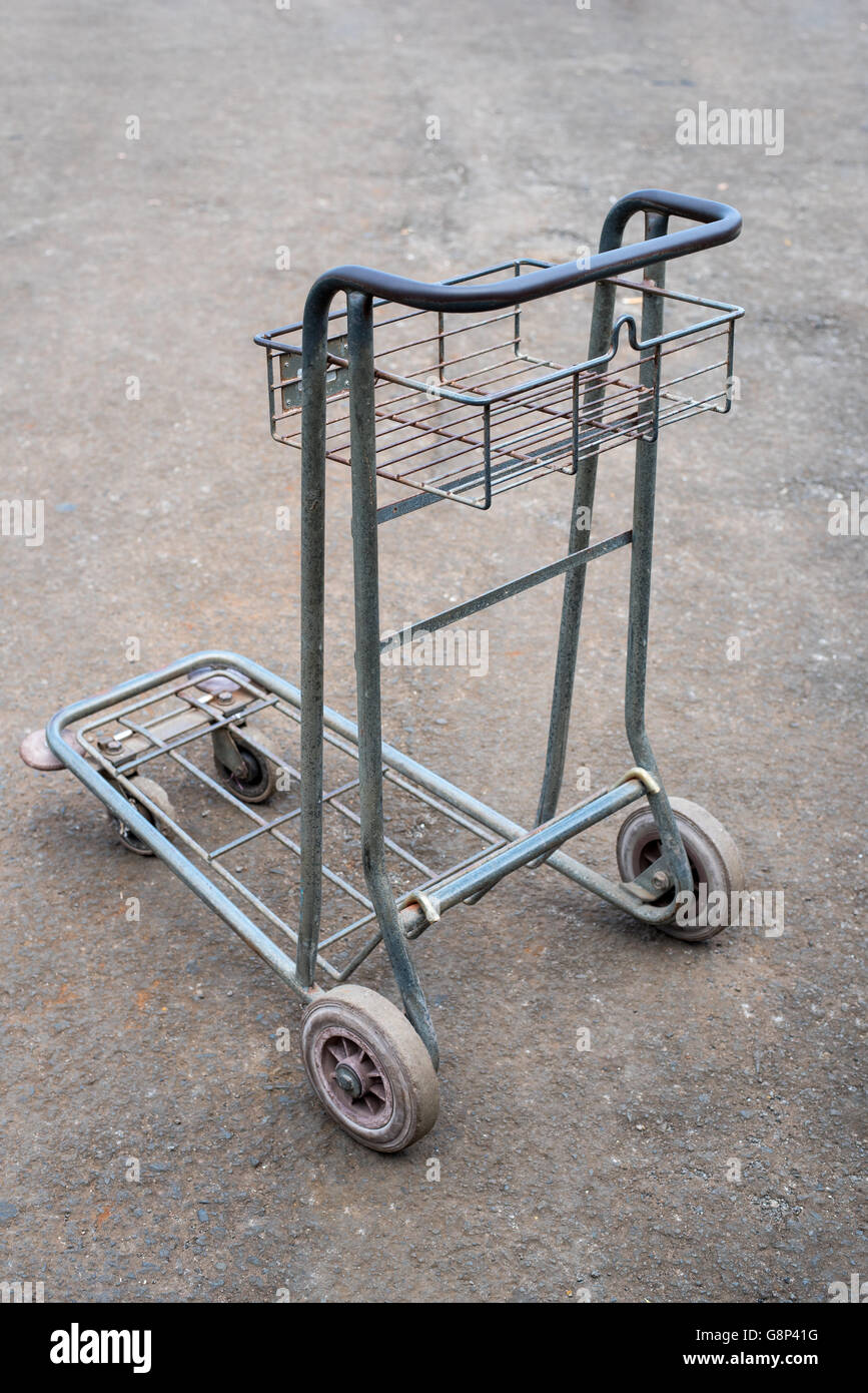 Abandoned empty old airport luggage cart on an old road Stock Photo - Alamy