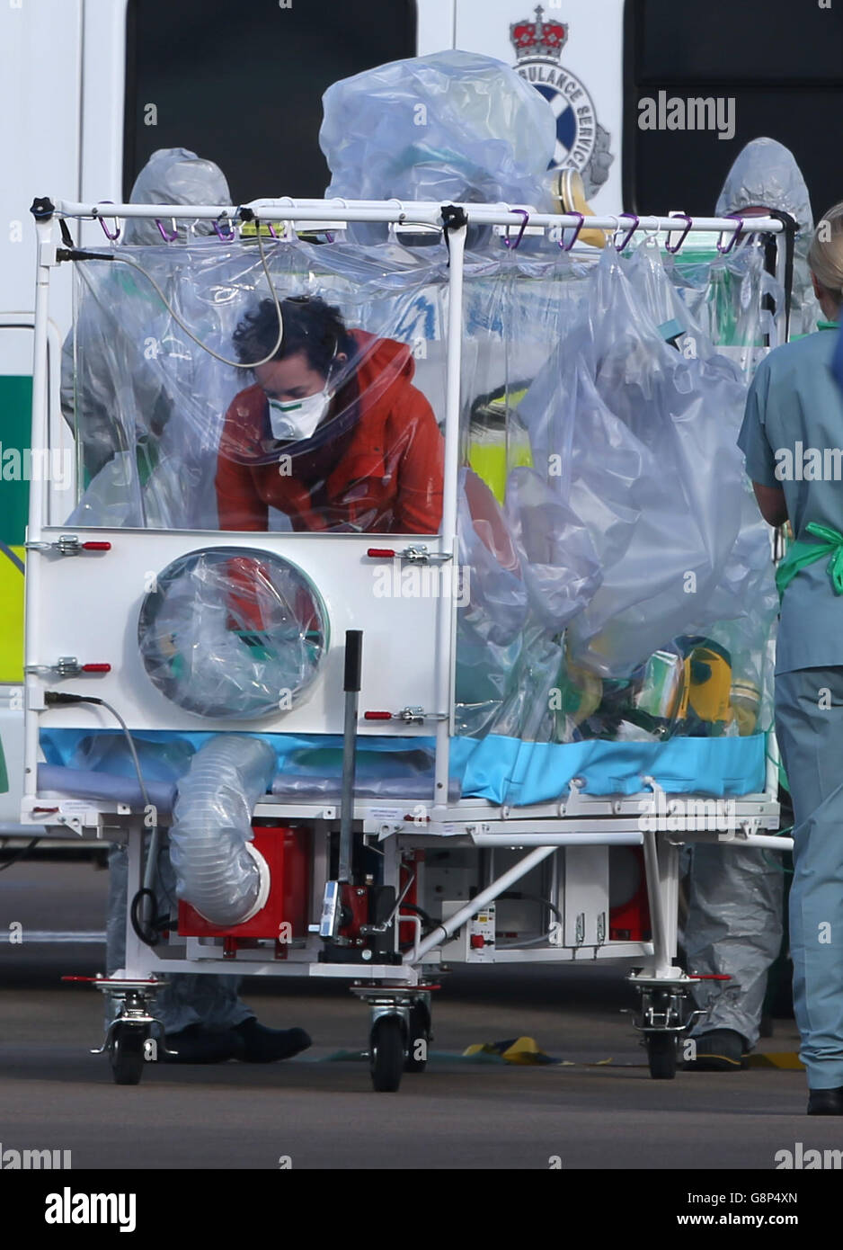 Nurse Pauline Cafferkey is transported to an RAF Hercules aircraft at ...