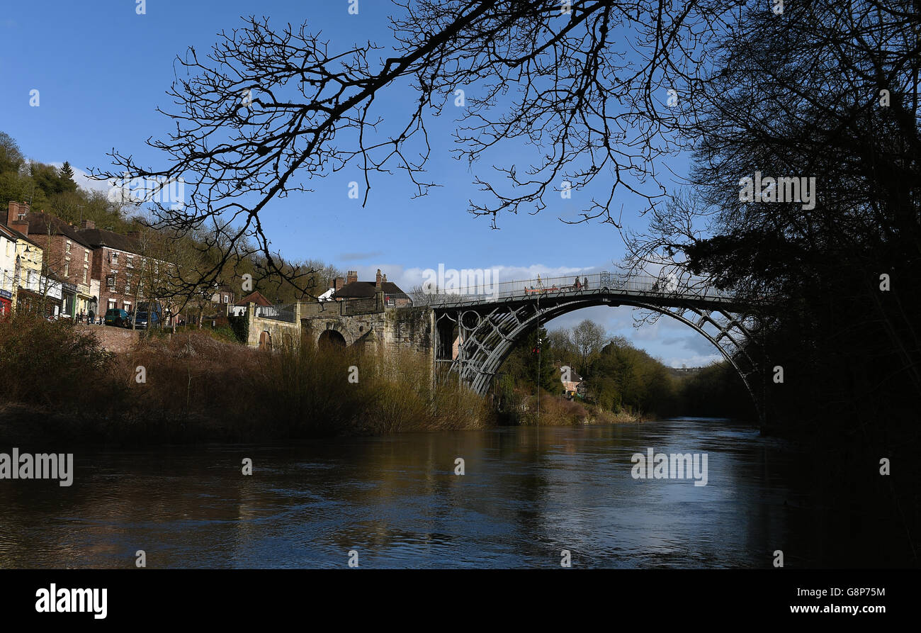 A surveyor abseils off the Iron Bridge over the River Severn in ...