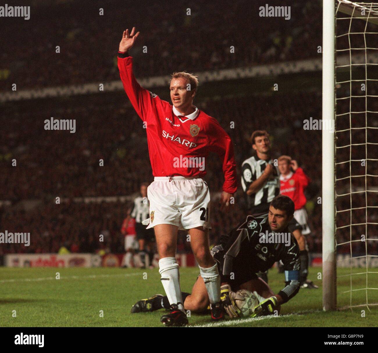 Manchester United's Henning Berg (left) appeals to the assistant ...