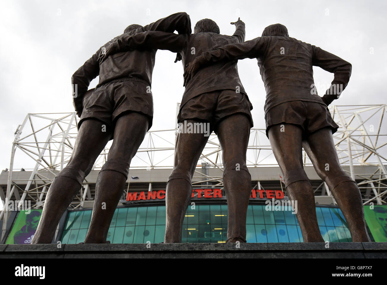 George best denis law bobby charlton statue old trafford hi-res stock ...
