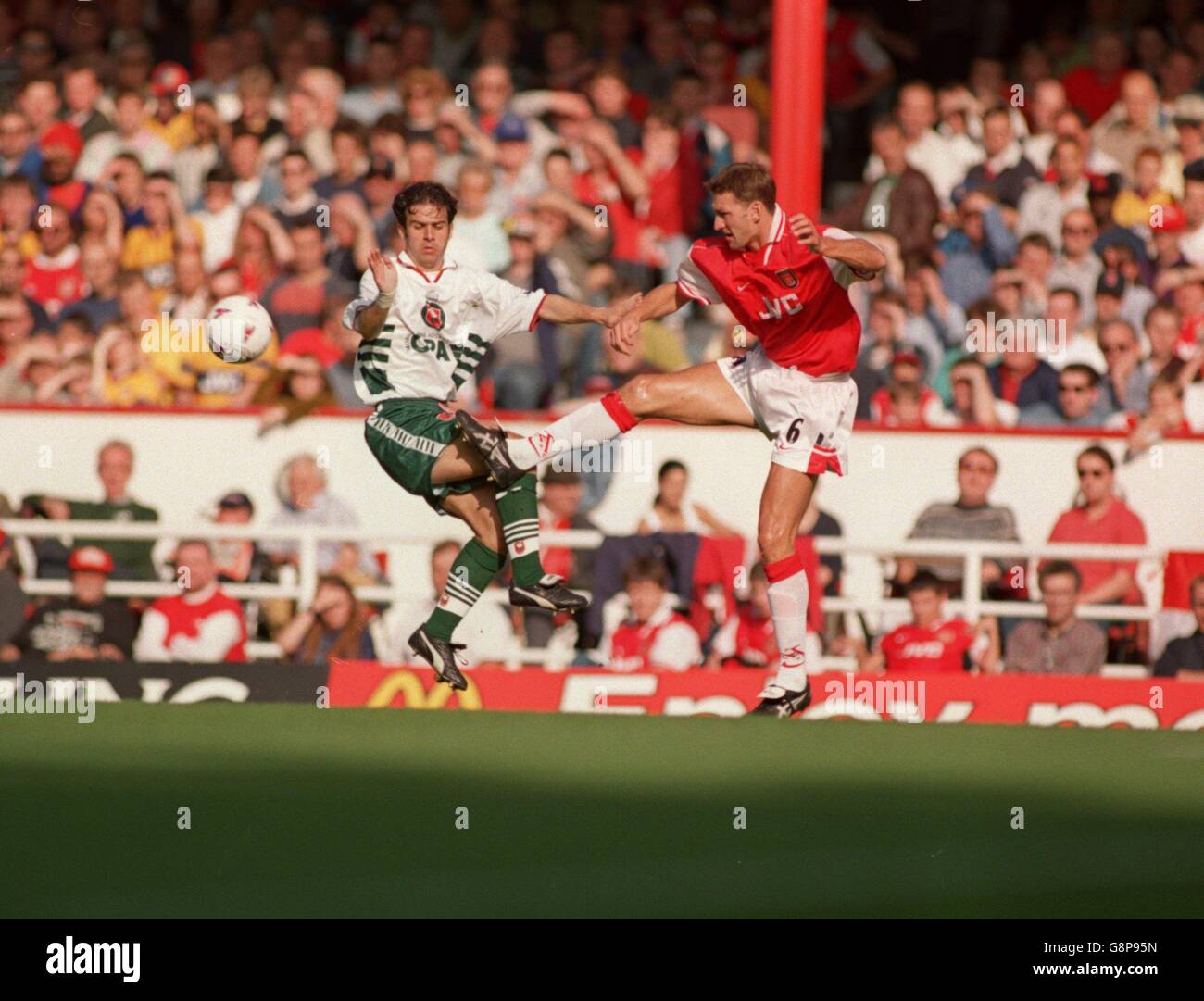 Barnsley's Ashley Ward (left) and Arsenal's Tony Adams (right) battle ...