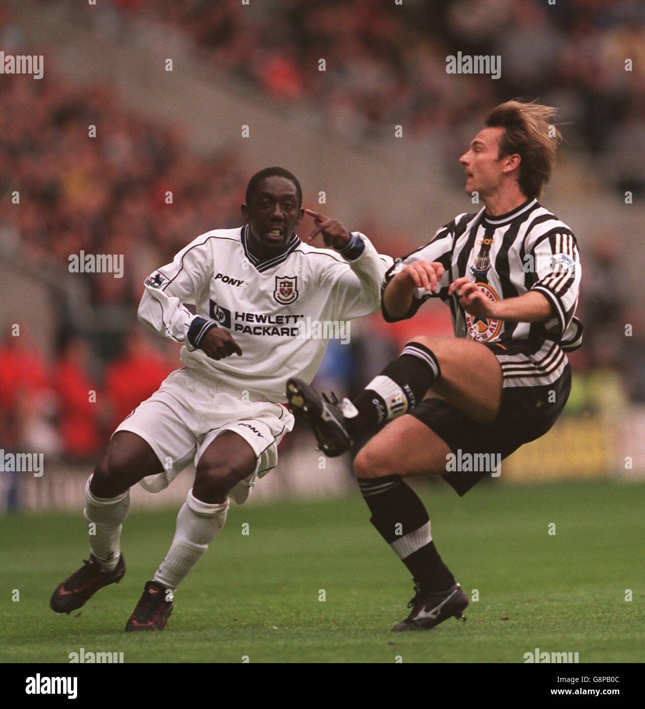 Ruel Fox of Tottenham Hotspur (left) and John Beresford of Newcastle ...