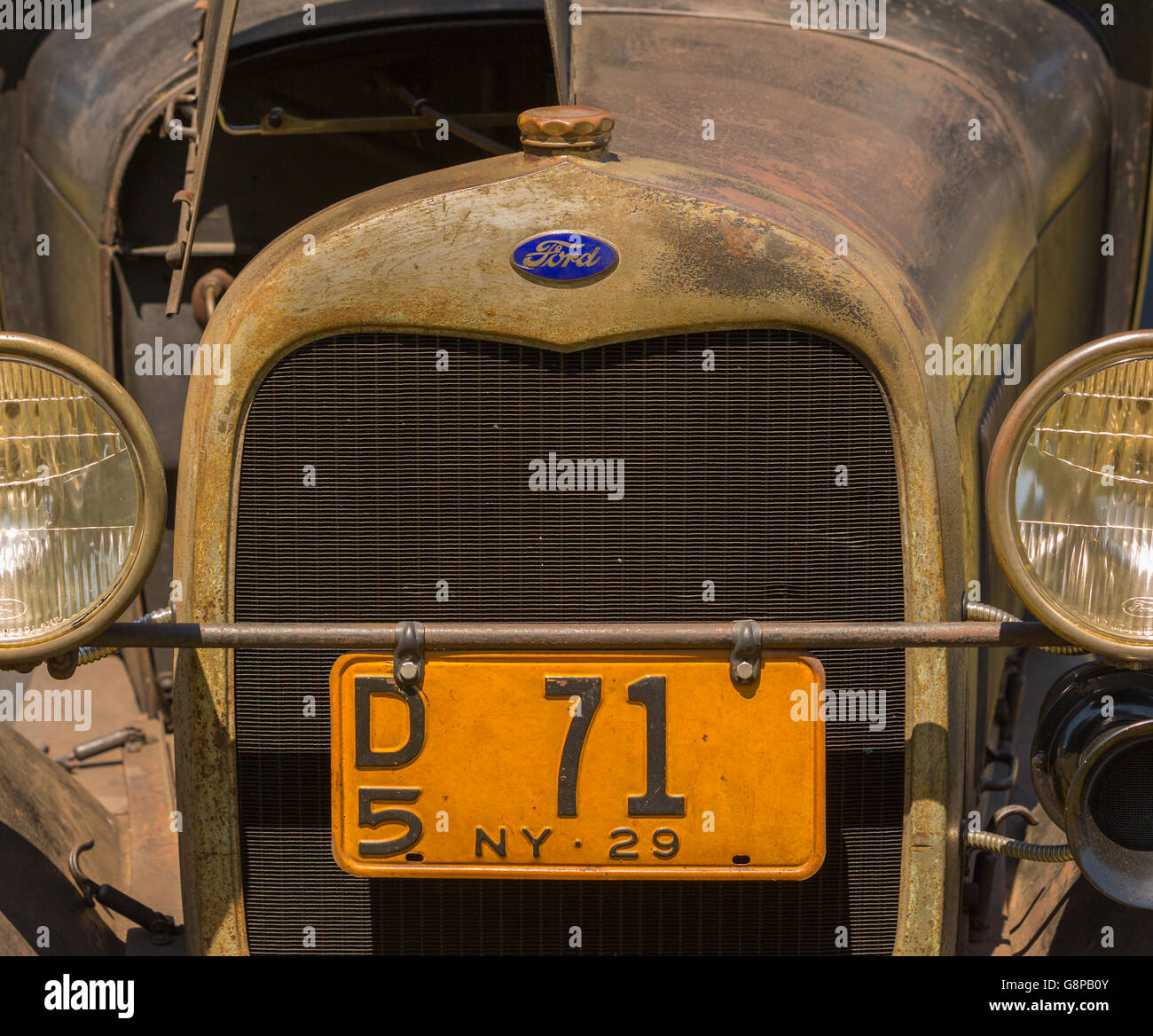 a detail image of an old Ford, Model T with an old 1929 NY license ...