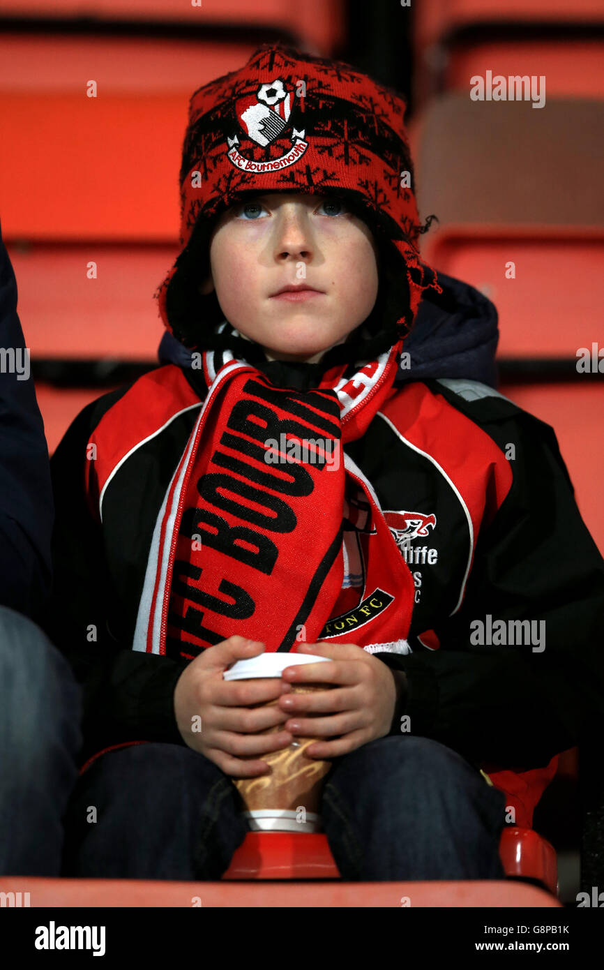Young afc bournemouth fan keeps warm in the the game hi-res stock ...