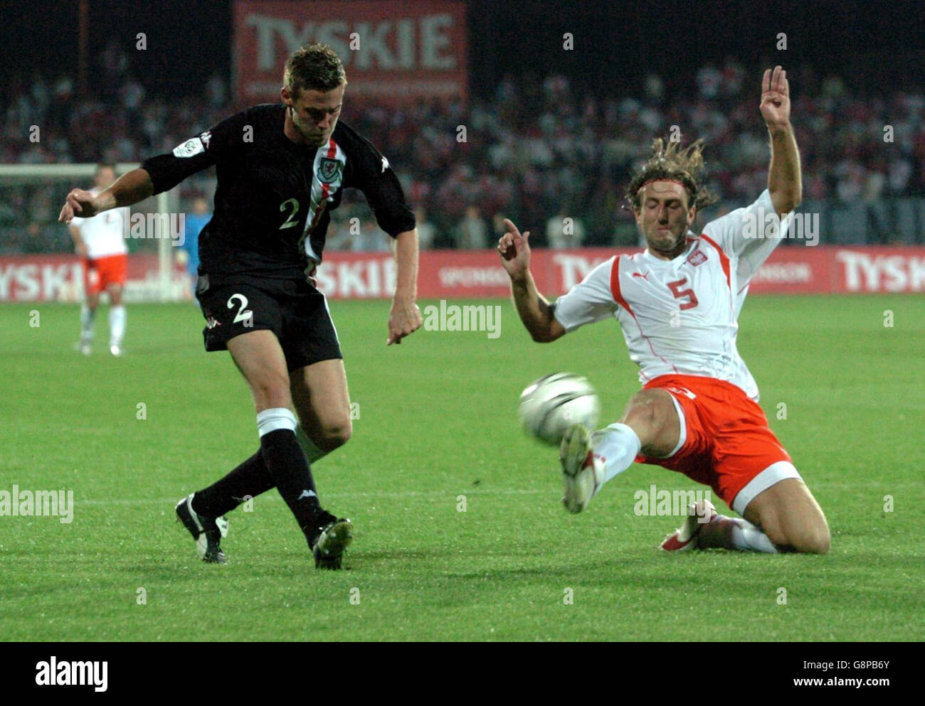 Wales' Robert Edwards (L) crosses from the byeline as Poland's Kamil ...