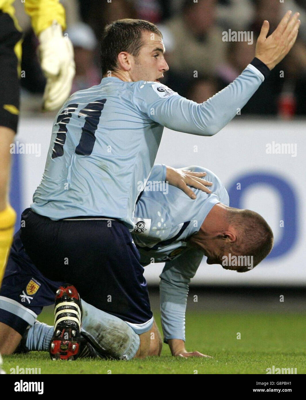 Scotland's Kenny Miller (R) with team mate James McFadden after being ...