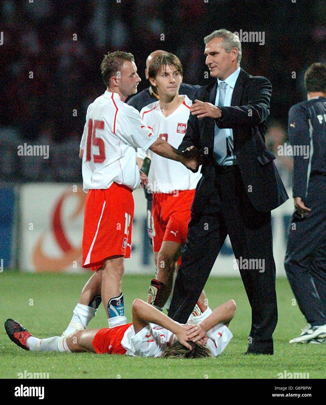 Poland's manager Pawel Janas congratulates his side after their 1-0 ...