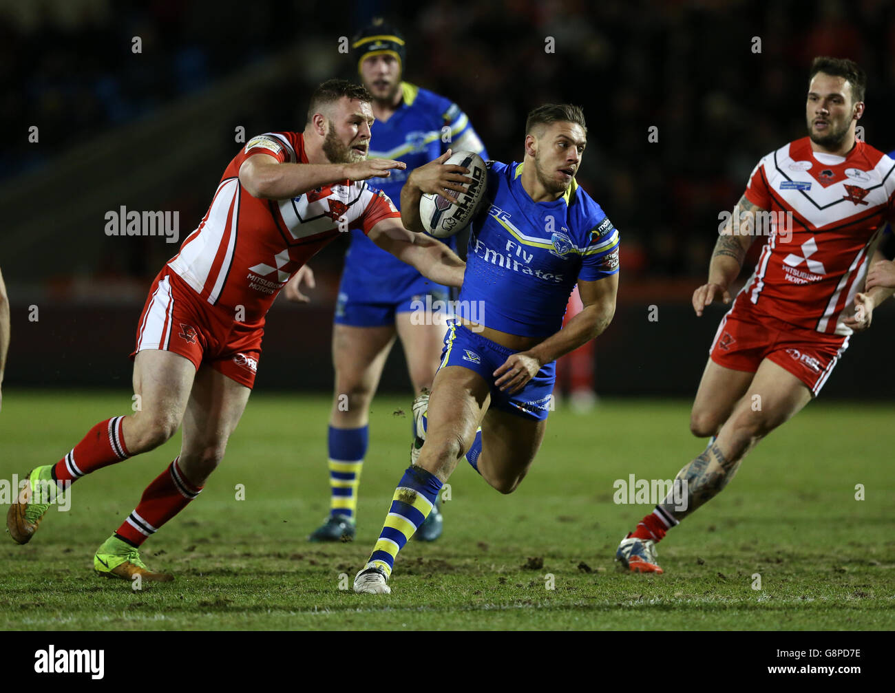 Warrington Wolves' Matty Russell (centre) tackles Salford Red Devils ...