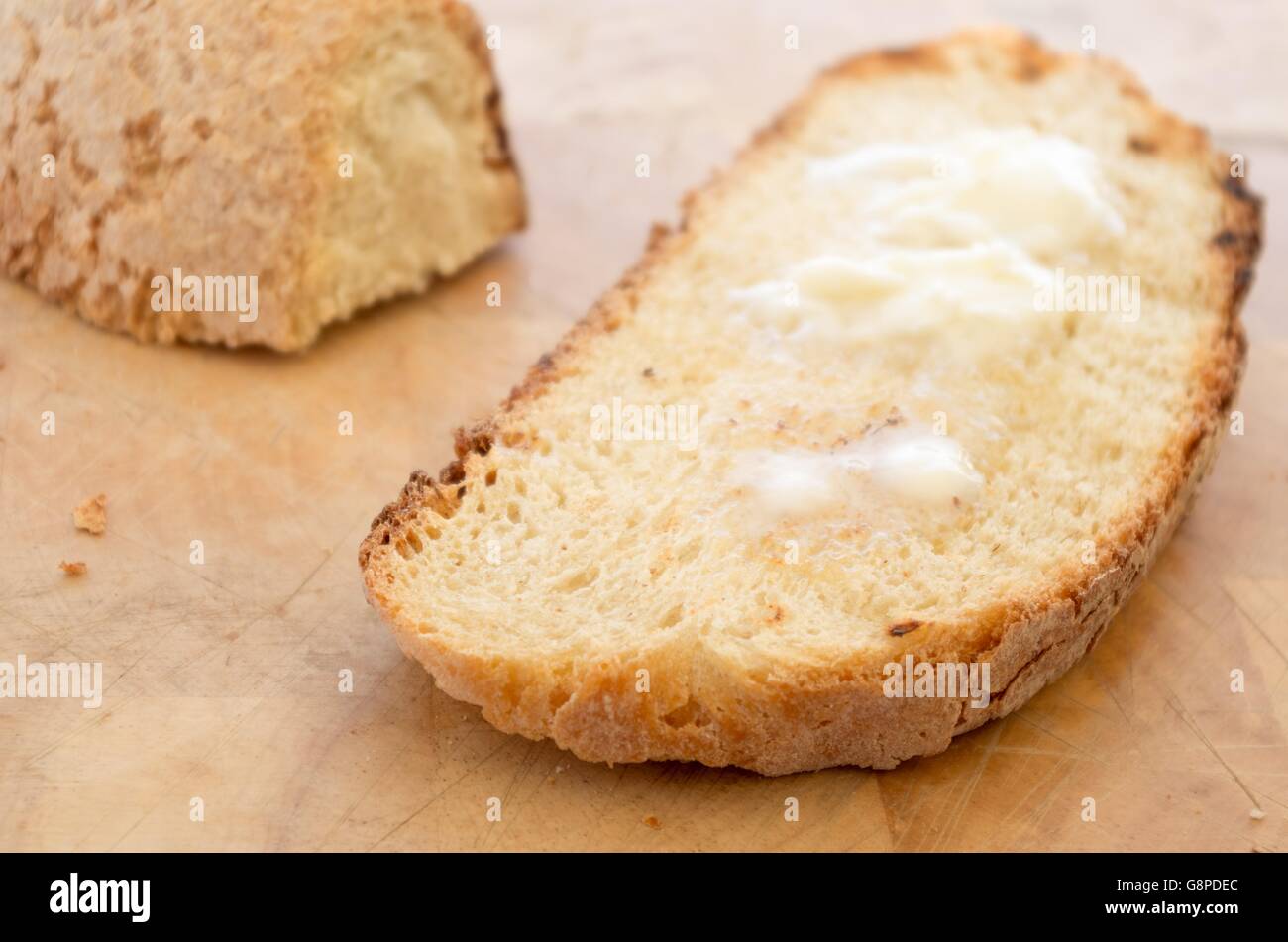 Melting butter on a slice of rustic toasted bread Stock Photo - Alamy